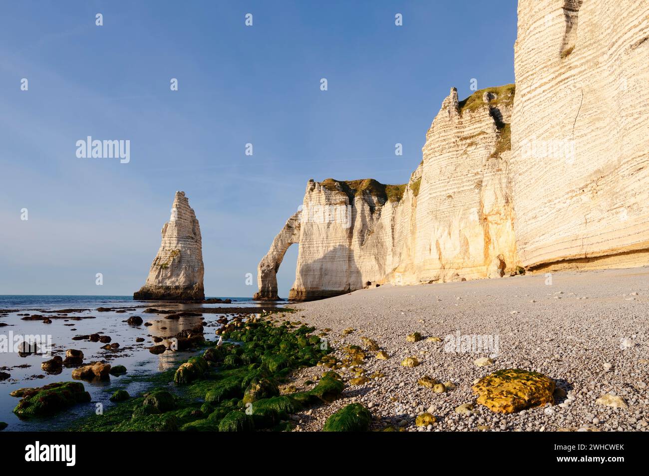 Steep cliffs with the Falaise d'Aval rock gate and the Aiguille ...