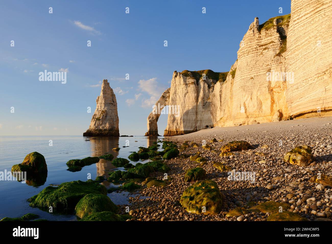 Steep cliffs with the Falaise d'Aval rock gate and the Aiguille ...