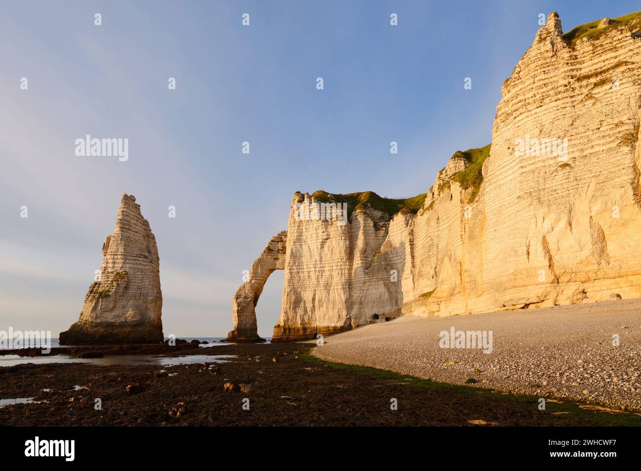 Steep cliffs with the Falaise d'Aval rock gate and the Aiguille ...