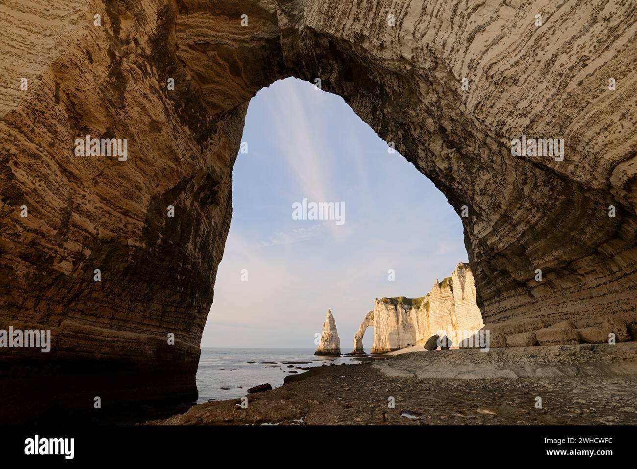 Manneporte rock arch and cliffs with the Aiguille díEtretat rock needle ...