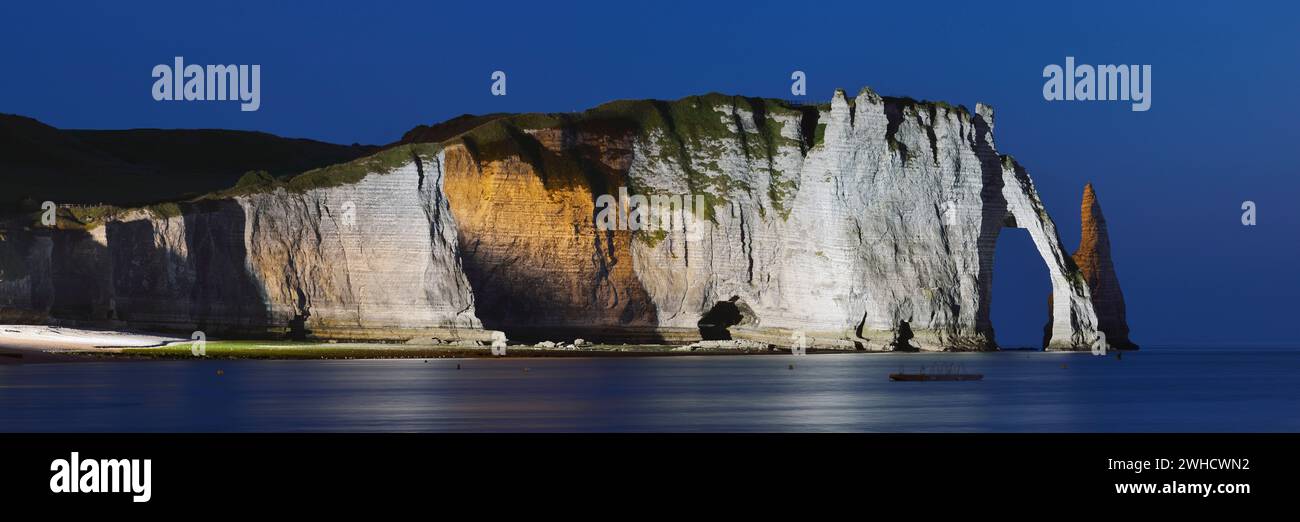Steep cliffs with the Falaise d'Aval rock gate and the Aiguille ...