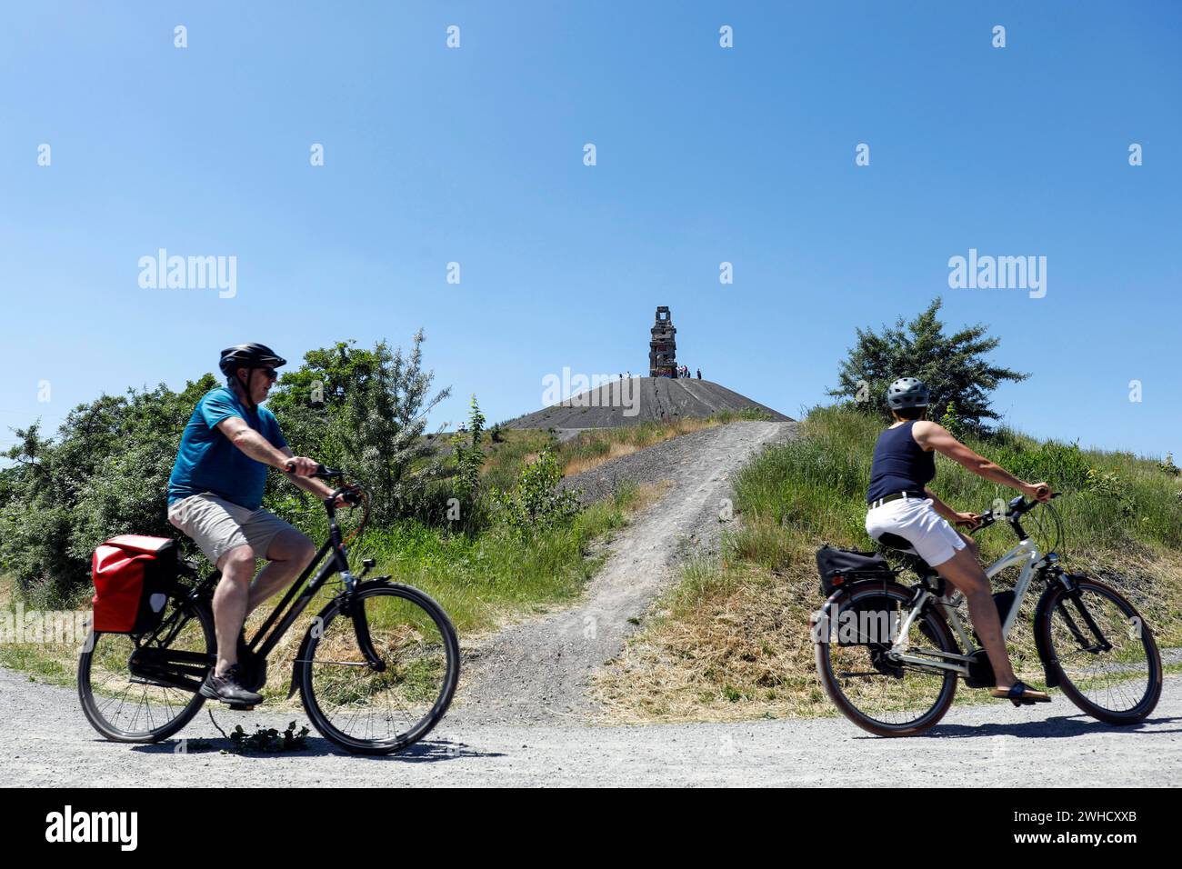 E-bikers cycle to the Rheinelbe spoil tip in Gelsenkirchen. The ...