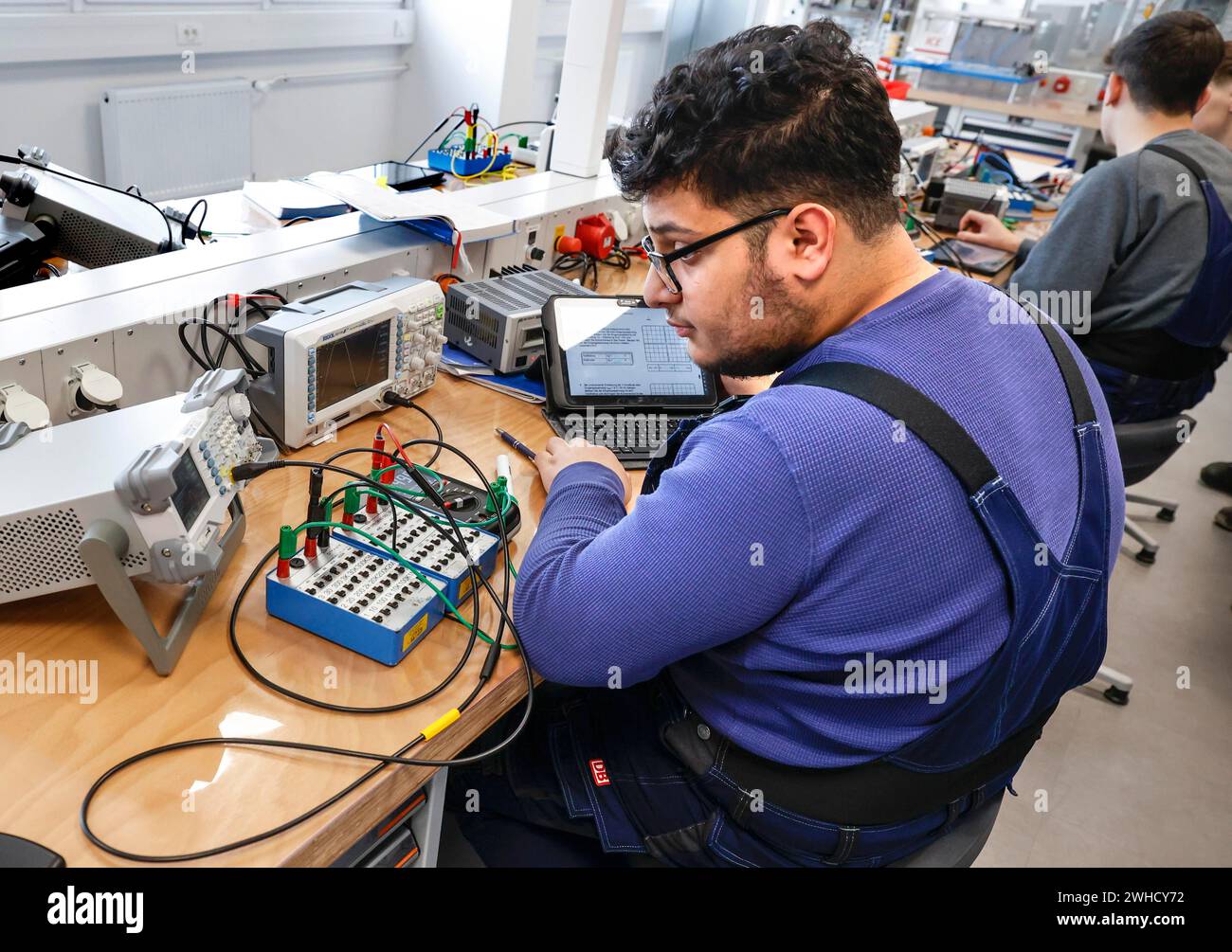 Trainees at a Deutsche Bahn training centre for industrial and ...