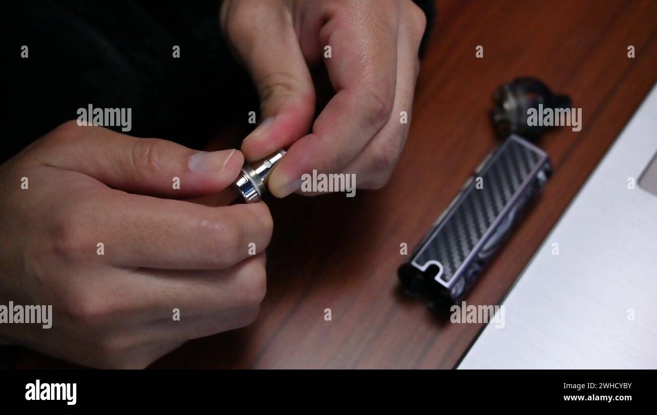 Rebuildable drip vaping atomizer tools, coil change closeup Stock Photo ...