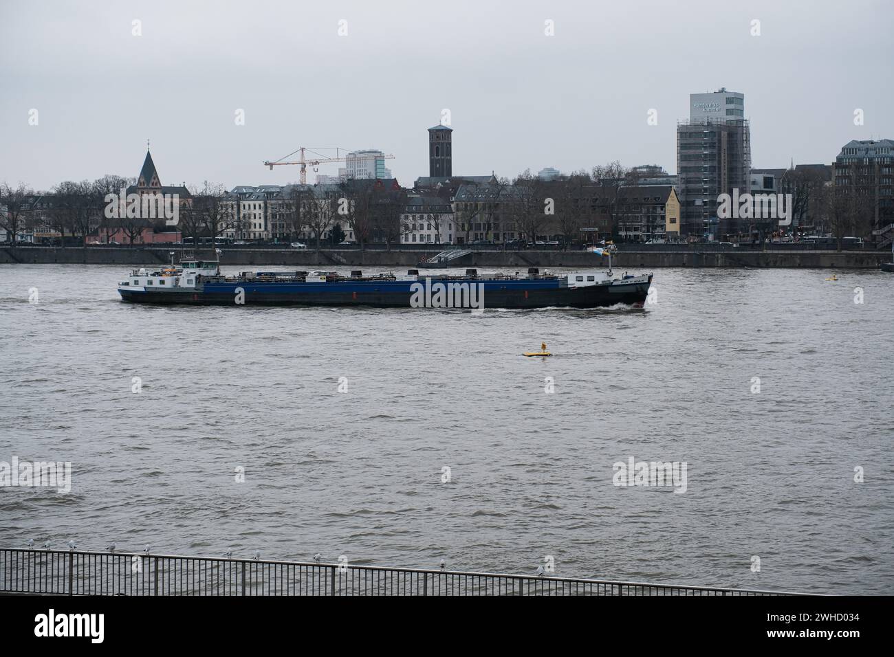 Cargo ship on the Rhine, historic city centre behind, Cologne, Germany ...