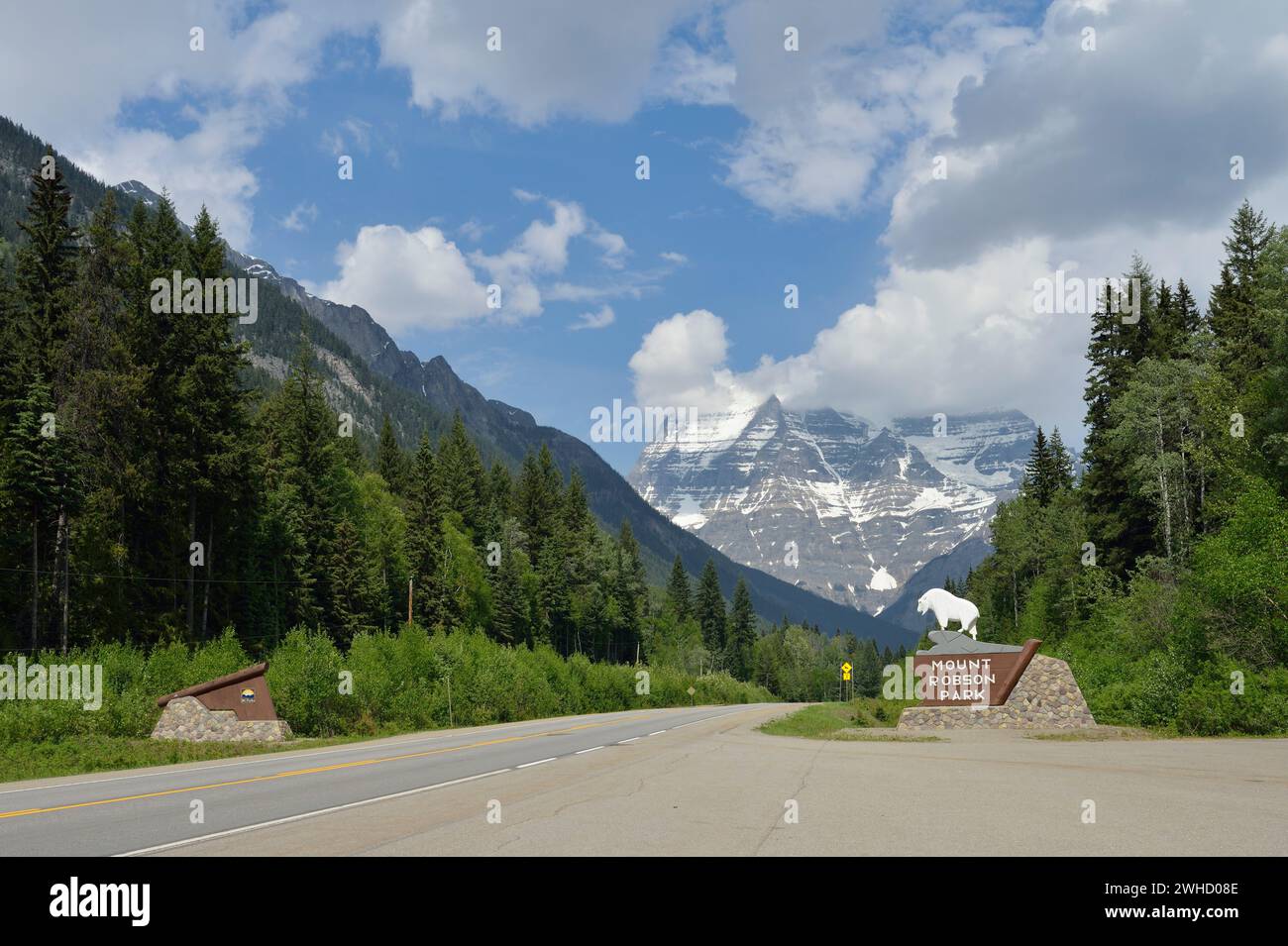 Sign with snow goat sculpture at the park entrance in front of Mount ...