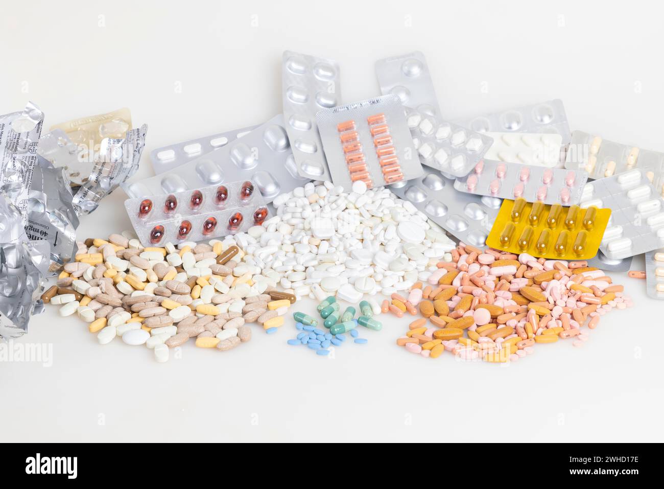 Empty and full blister packs with tablets of different colours and ...