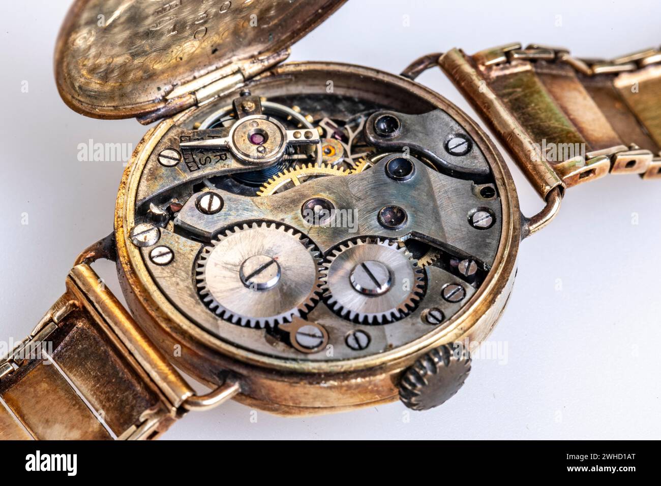 Inner mechanics of a vintage clock with exposed movement and gears ...