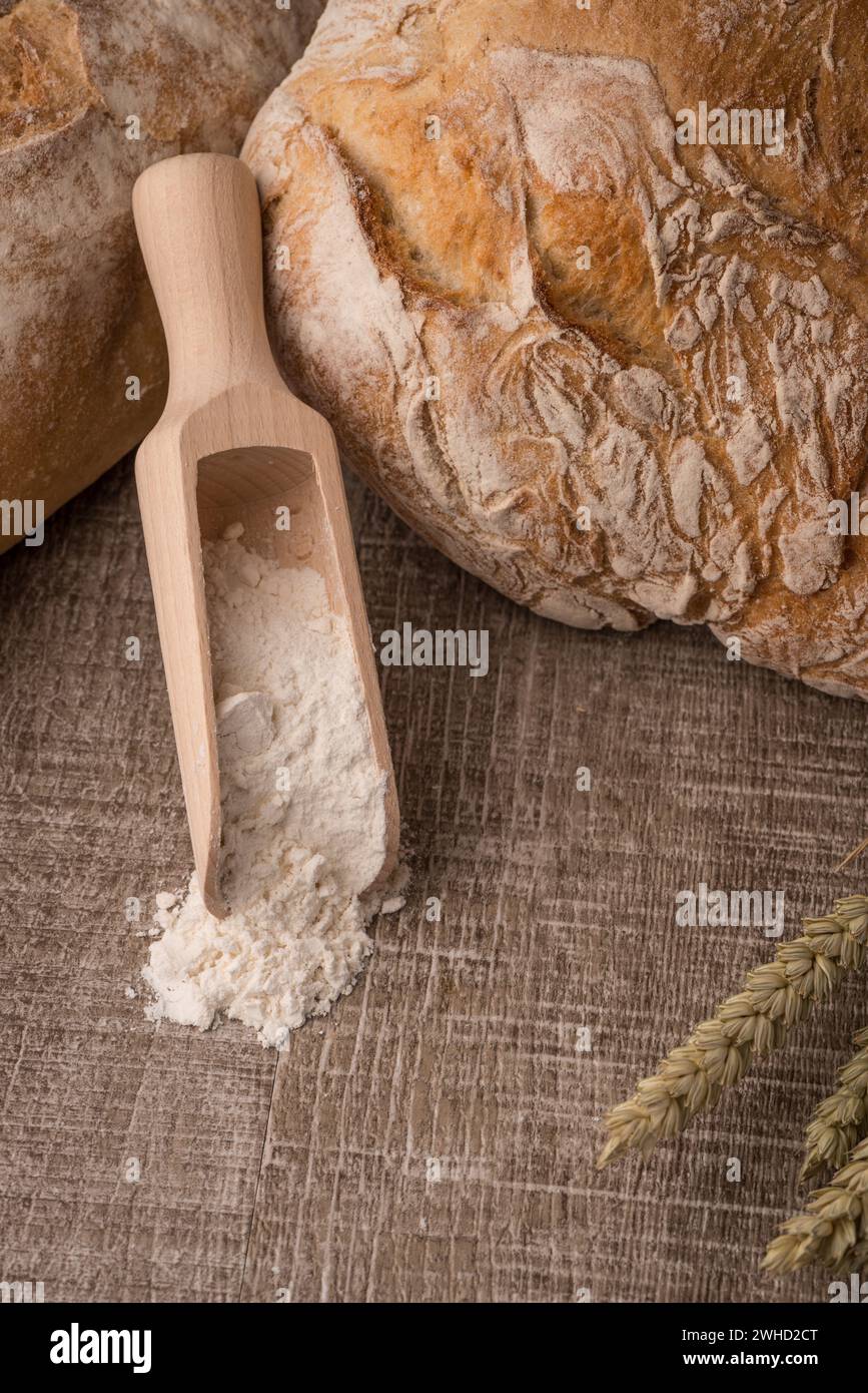 Rustic bread and wheat Stock Photo - Alamy