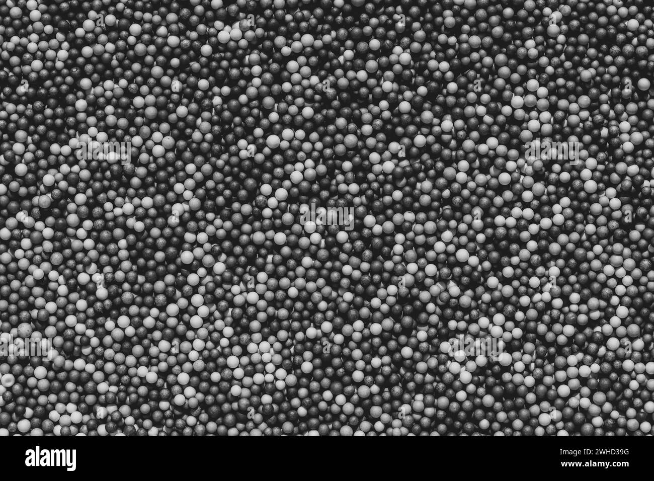 Many different colored small balls Black and White Stock Photos ...