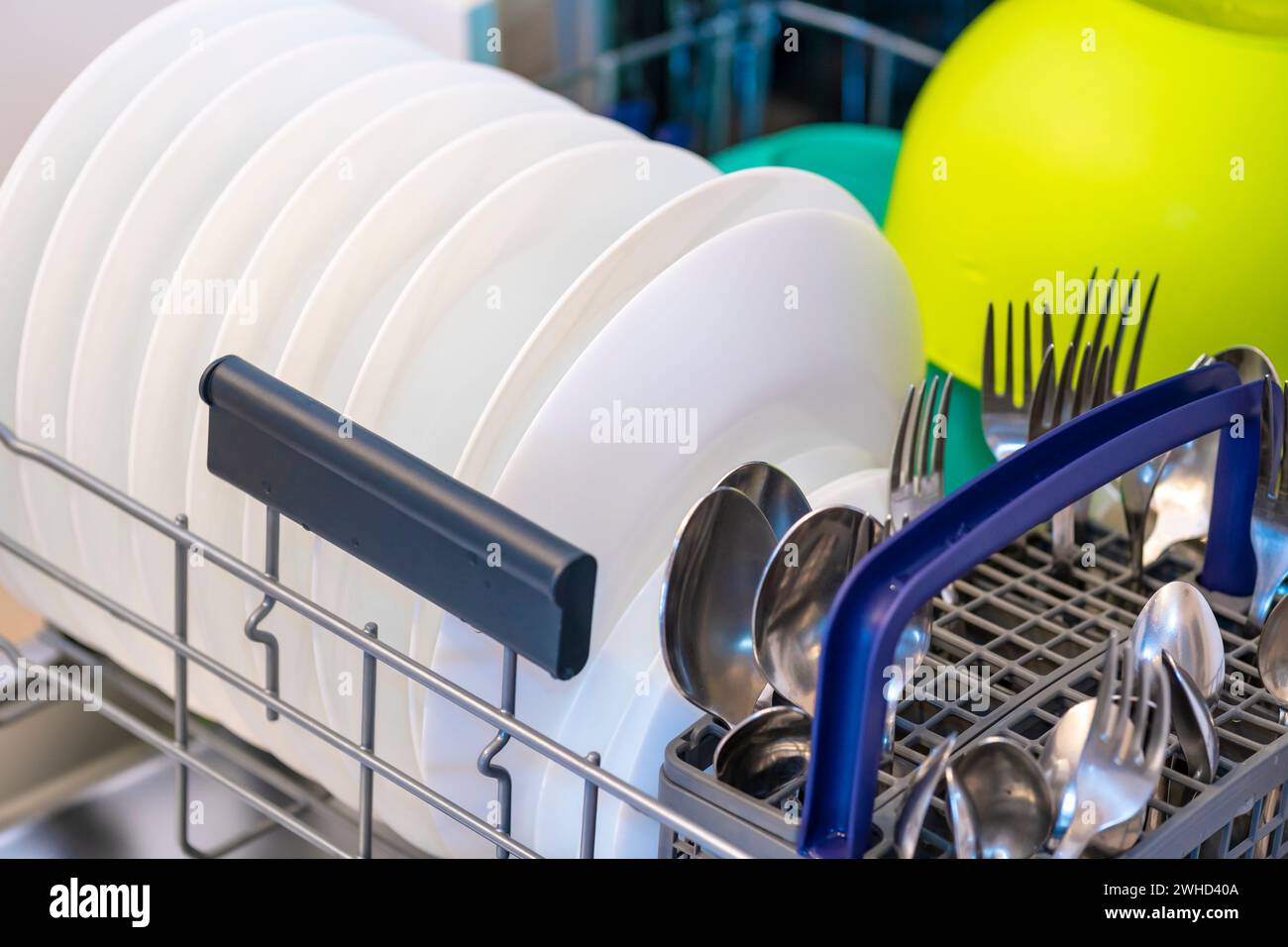 Open dishwasher. The washed dishes. Clean cutlery. Kitchen hygiene ...