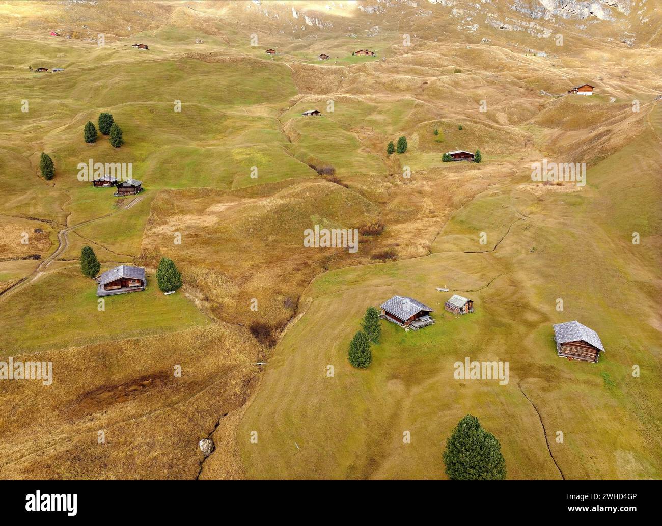View from the Seceda Alm of mountain huts in autumn, Puez-Geisler ...