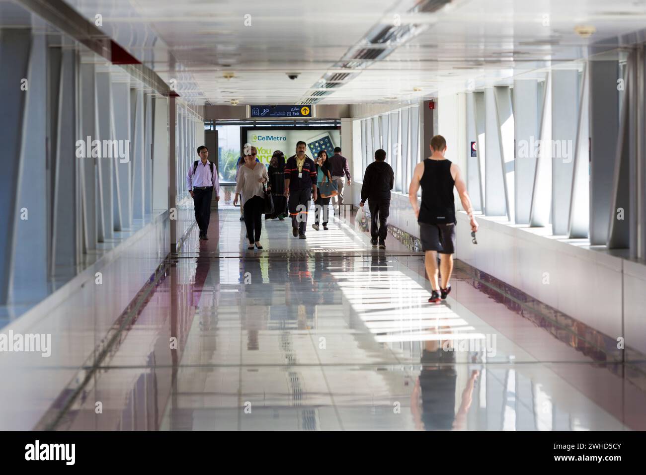 Dubai, UAE - January 07, 2016: Front view of walking passengers with ...