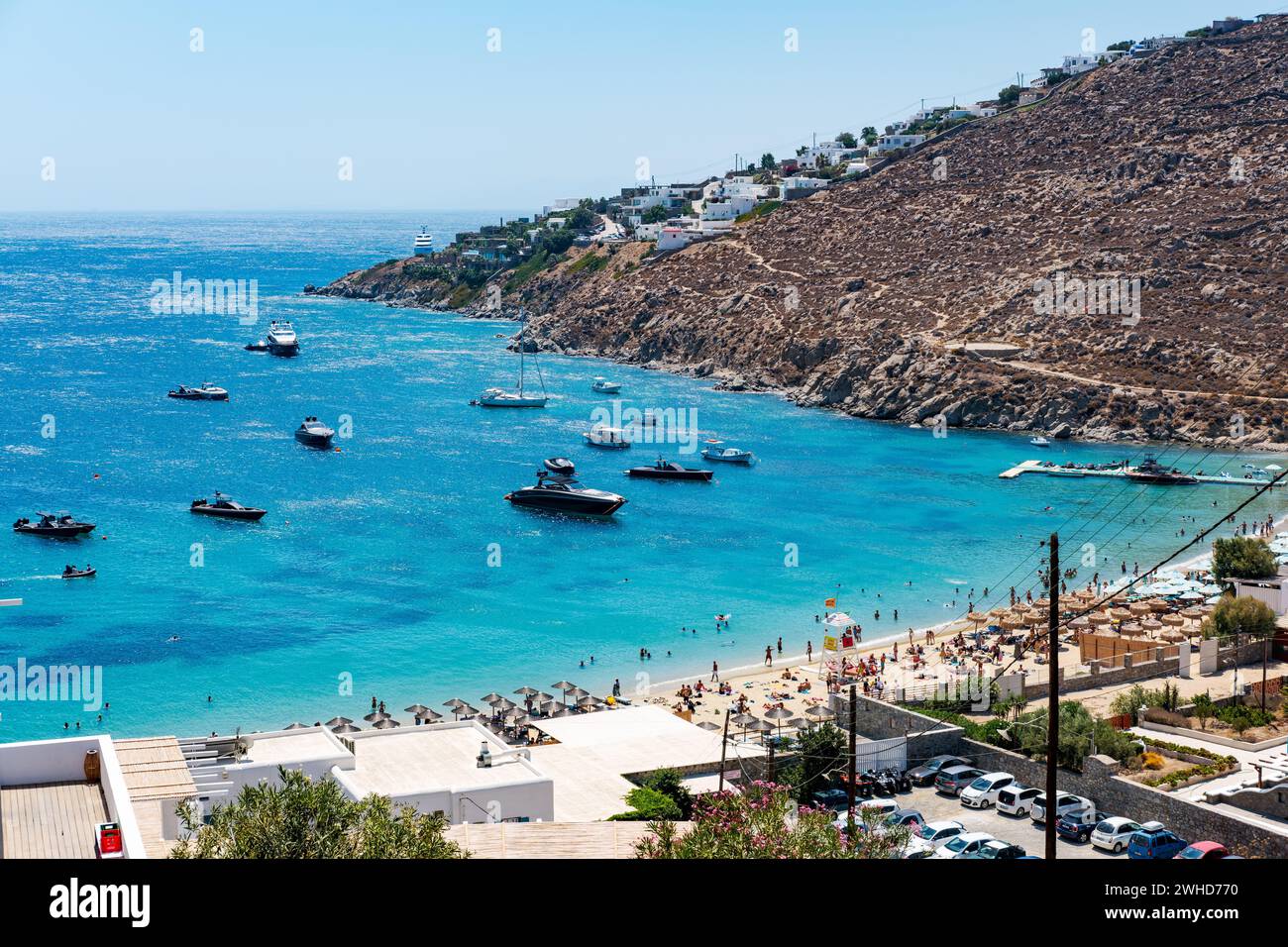 Psarou beach in Mykonos Greece blue sea, umbrella and luxury beach ...