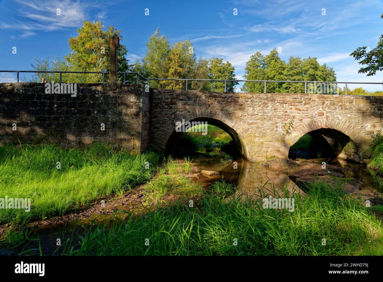 Historic arch bridge over the course of the Thulba river in the ...