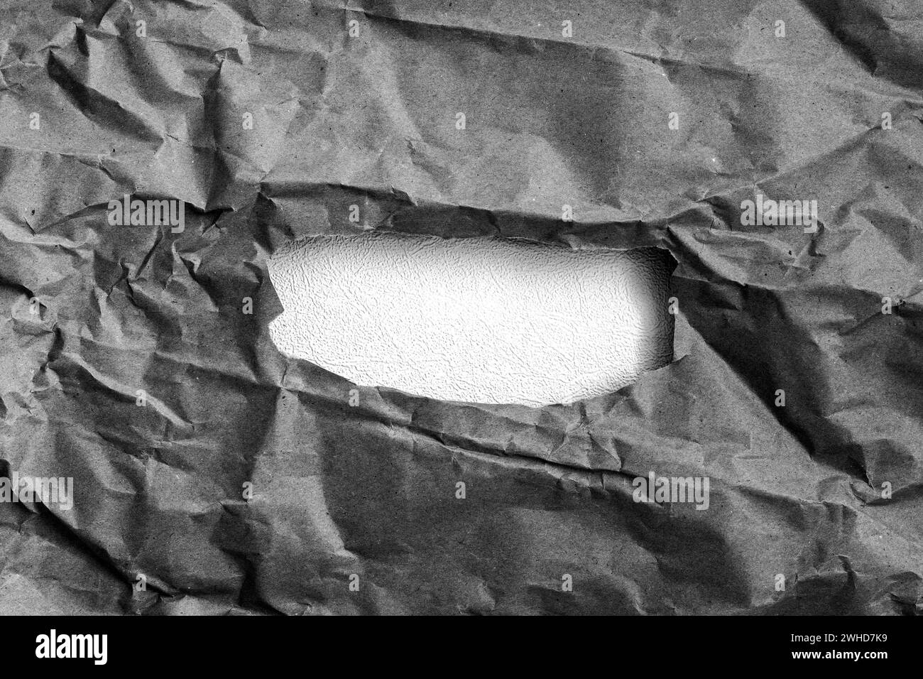 hole in paper with color paper background inside. Good paper texture ...