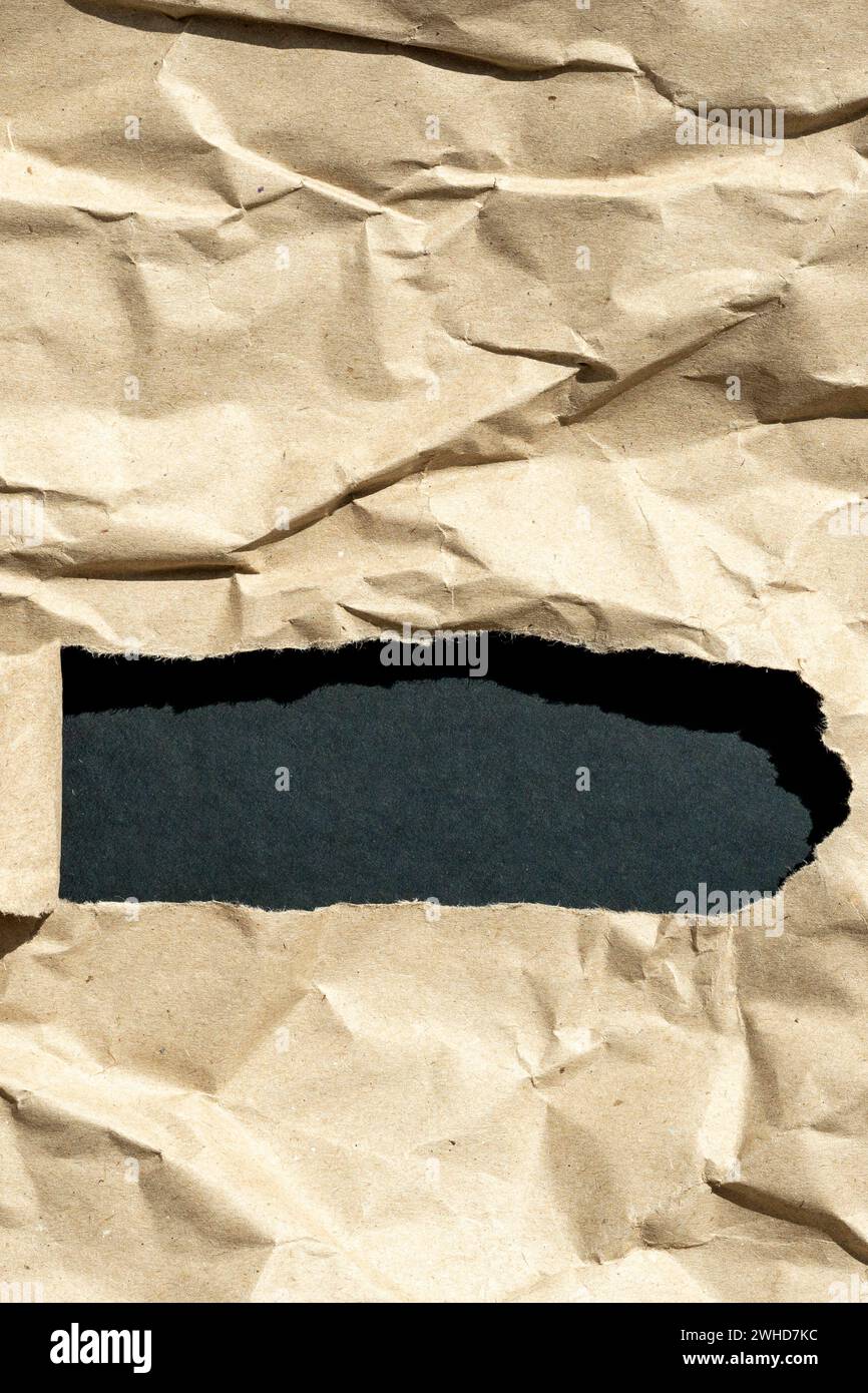 hole in paper with color paper background inside. Good paper texture ...