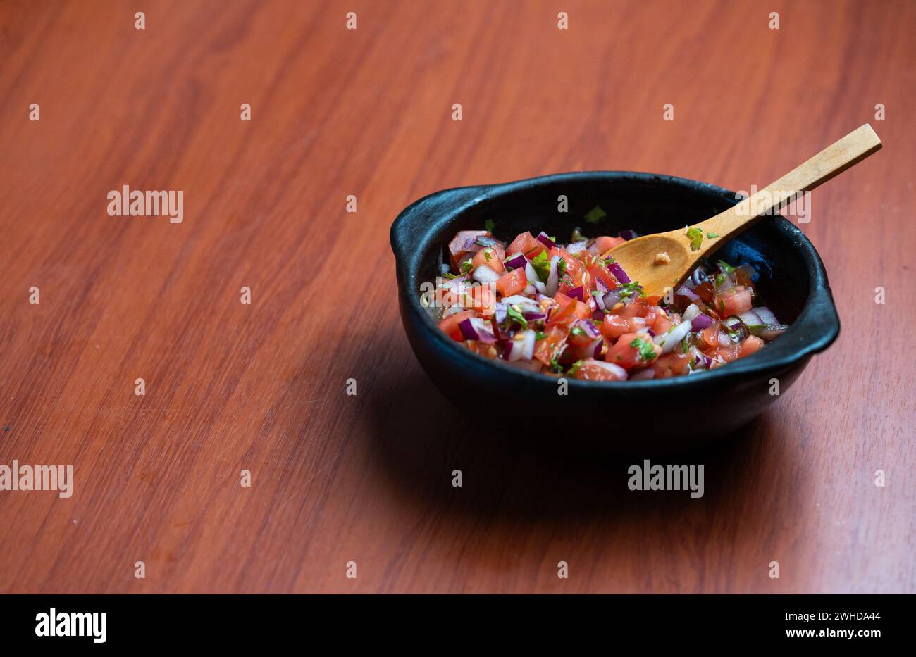 Chilean Pebre sauce, a traditional dip made of tomato, onion, spicy aji ...