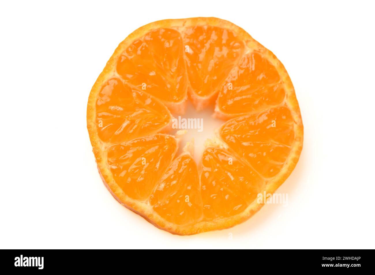 slice of juicy tangerine on a white background Stock Photo - Alamy