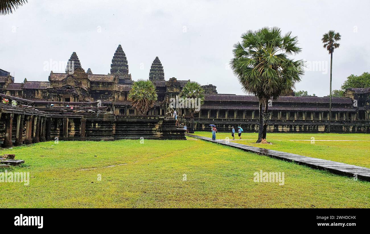 Angkor Wat temple outer quadrangle on a rain soaked day. The temple is ...