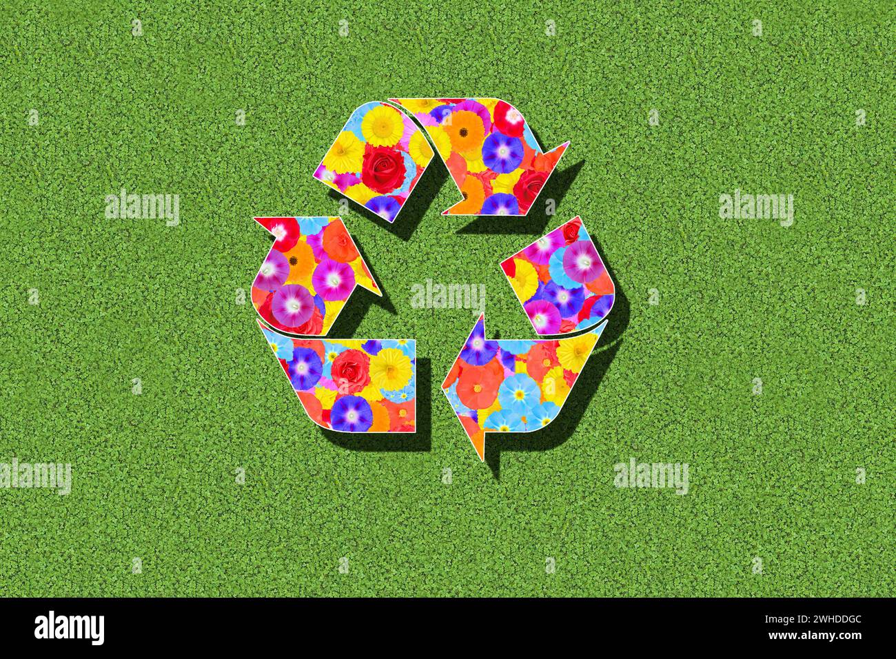 Sign for recycling with many colourful flowers on a green background ...