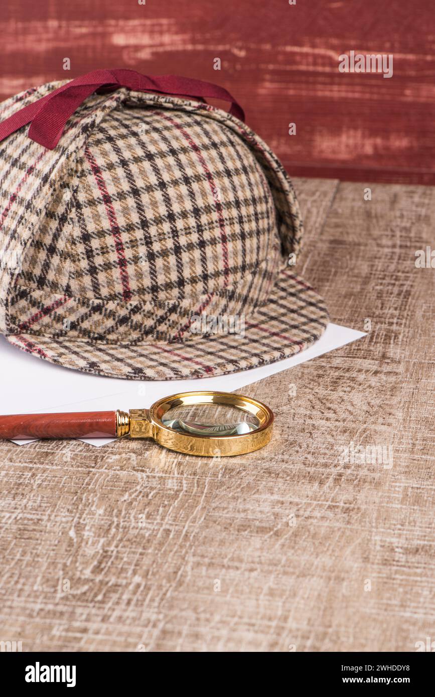 Paper sheets and magnifying glass Stock Photo - Alamy