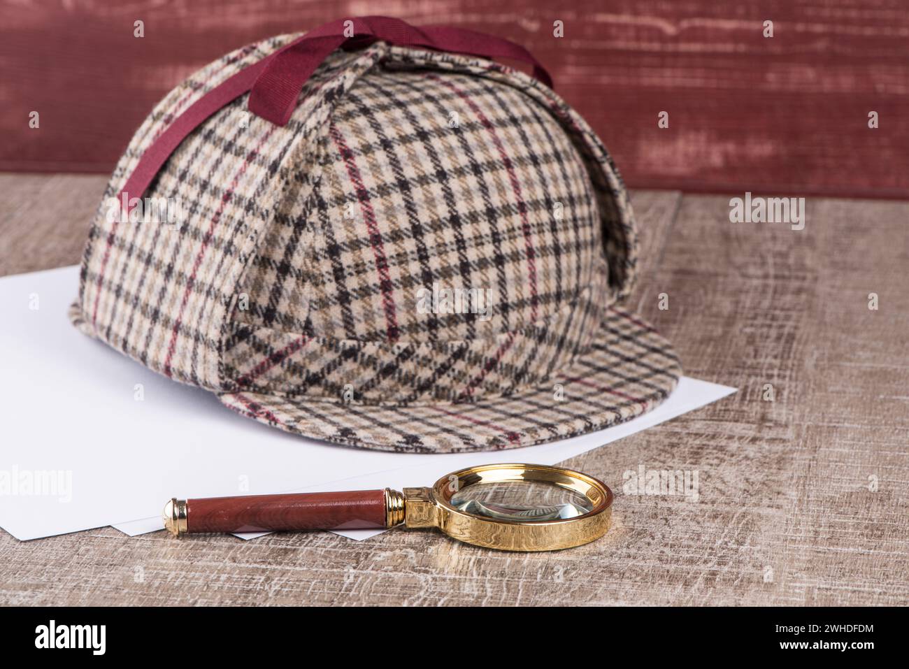 Paper sheets and magnifying glass Stock Photo - Alamy
