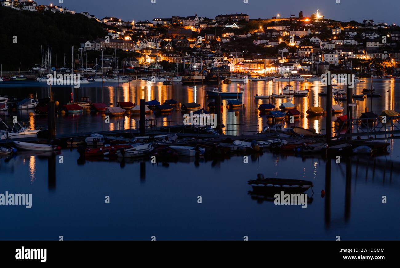 View of the illuminated harbor in the bay of Fowey in Cornwall, Great ...