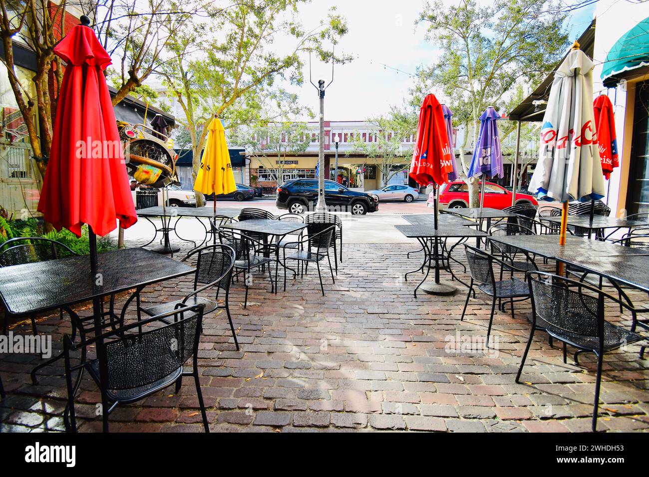 outdoor restaurant with colorful umbrellas Stock Photo - Alamy