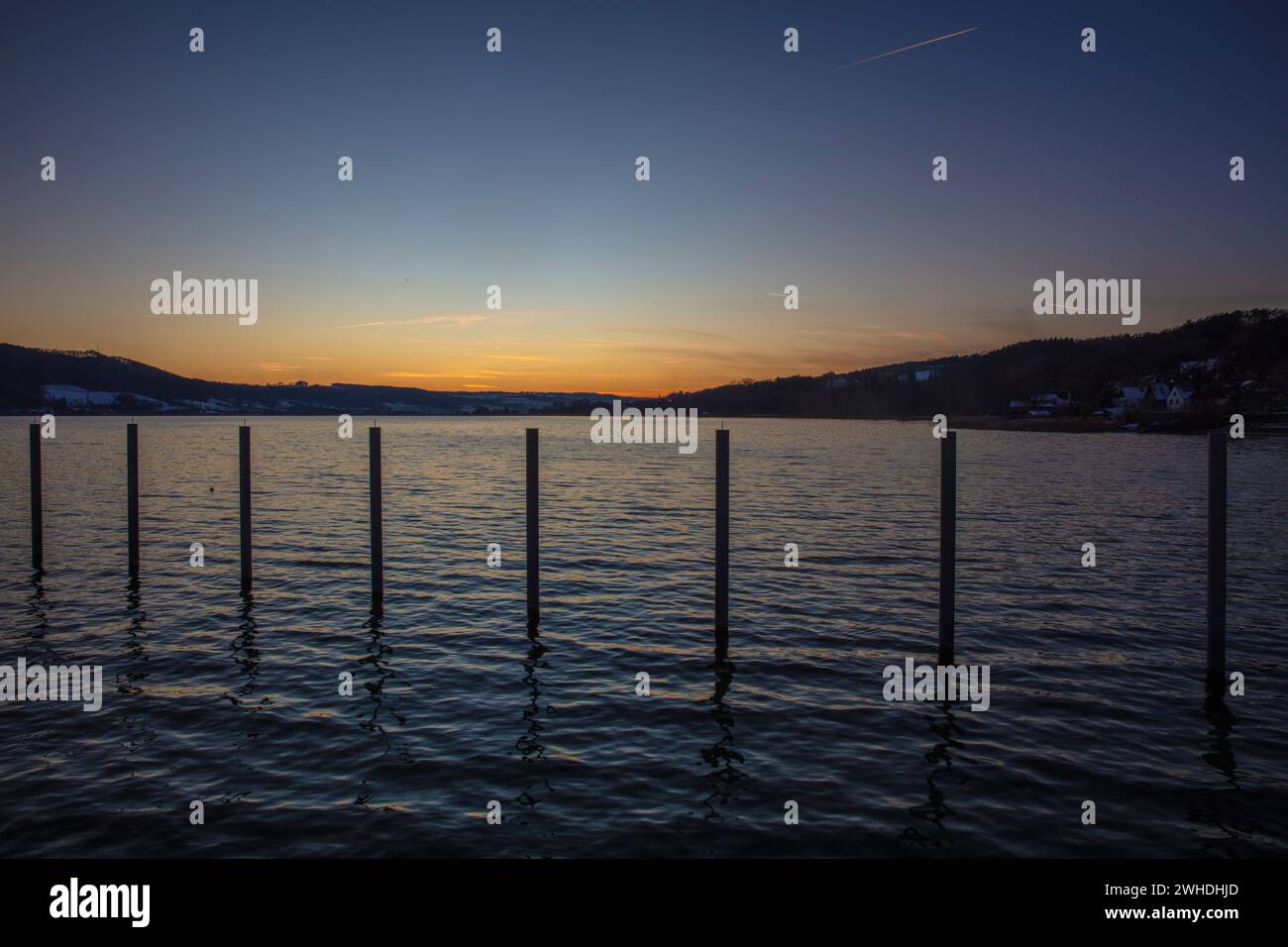 Lake Constance, winter, sunset, poles Stock Photo - Alamy