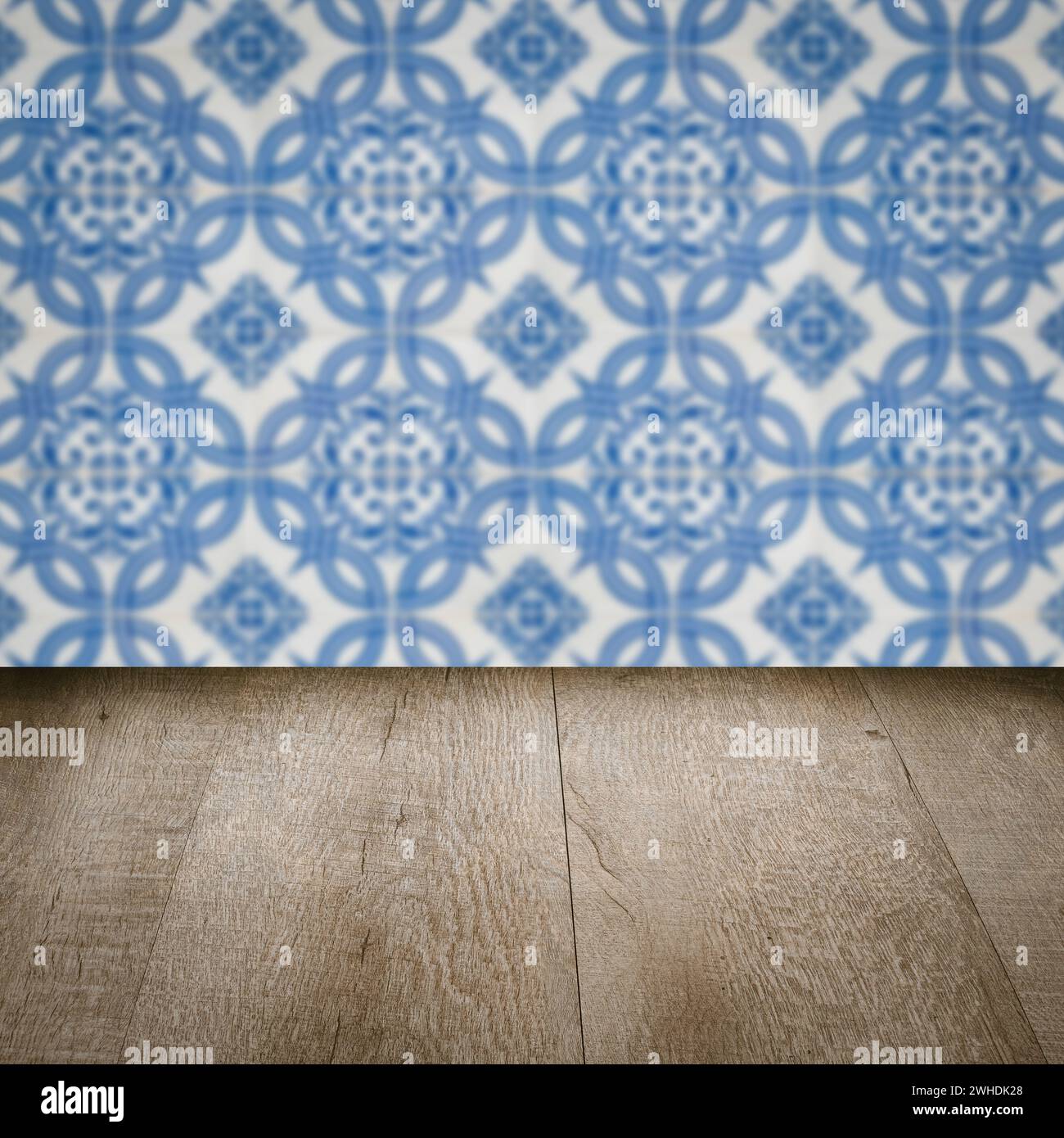 Wood table top and blur vintage ceramic tile pattern wall Stock Photo ...