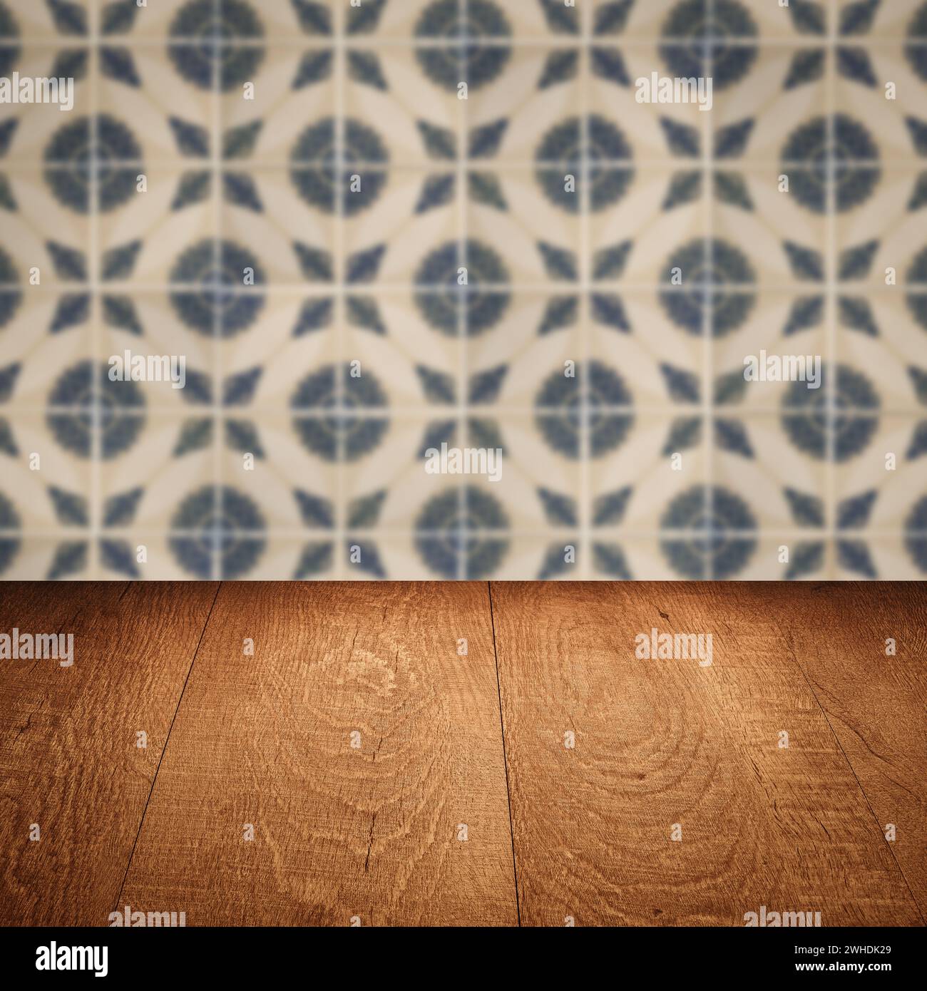 Wood table top and blur vintage ceramic tile pattern wall Stock Photo ...