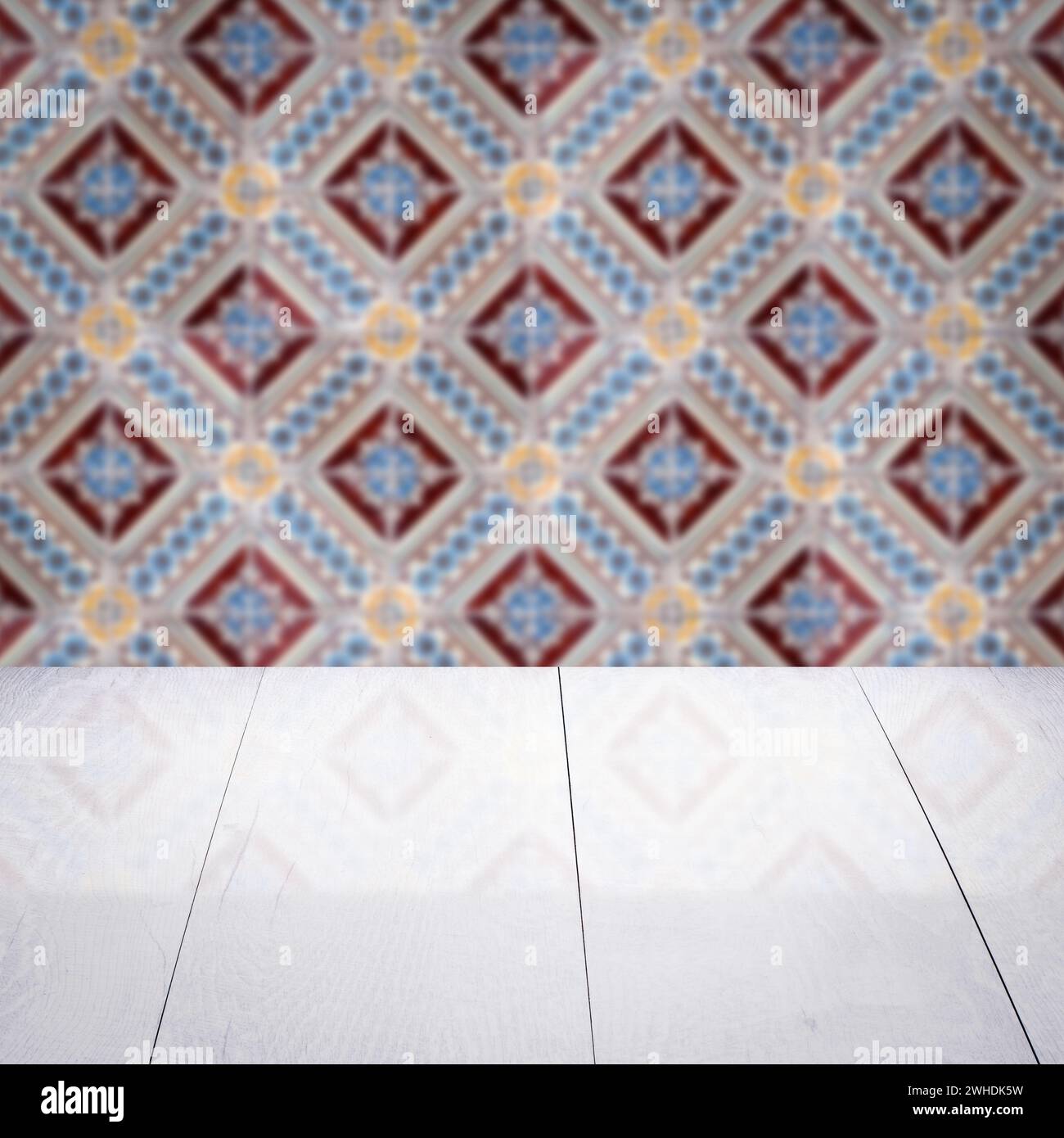 Wood table top and blur vintage ceramic tile pattern wall Stock Photo ...