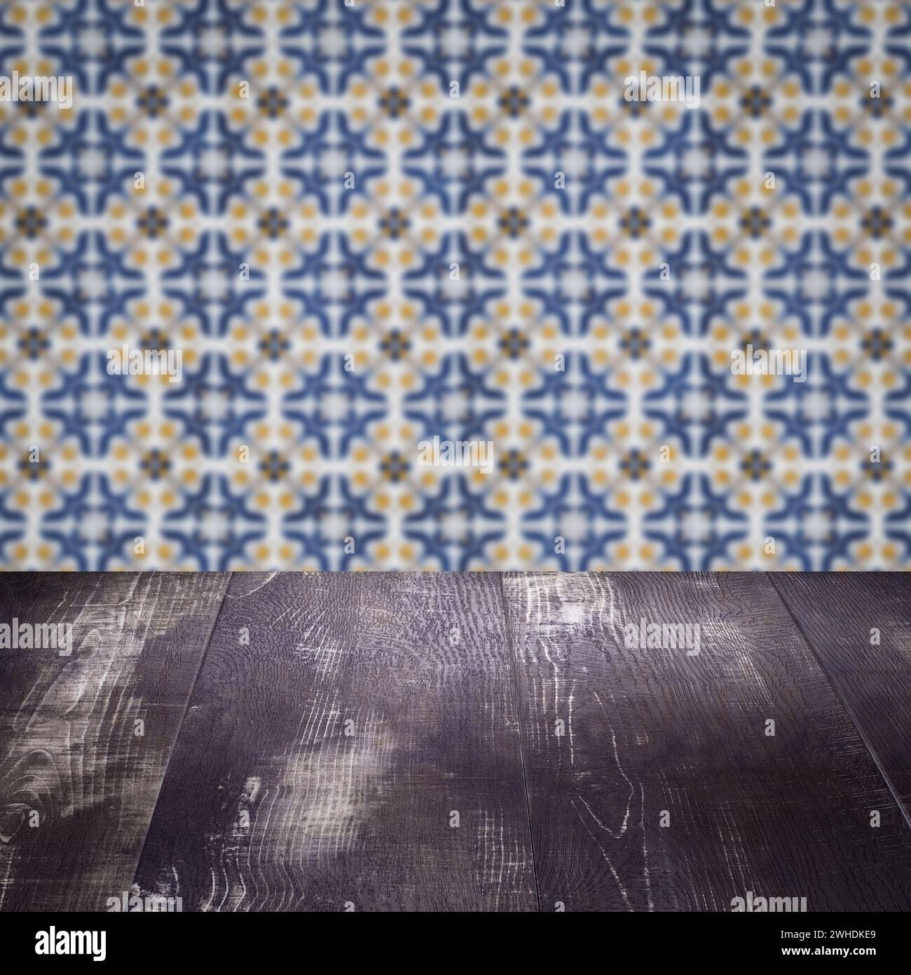 Wood table top and blur vintage ceramic tile pattern wall Stock Photo ...