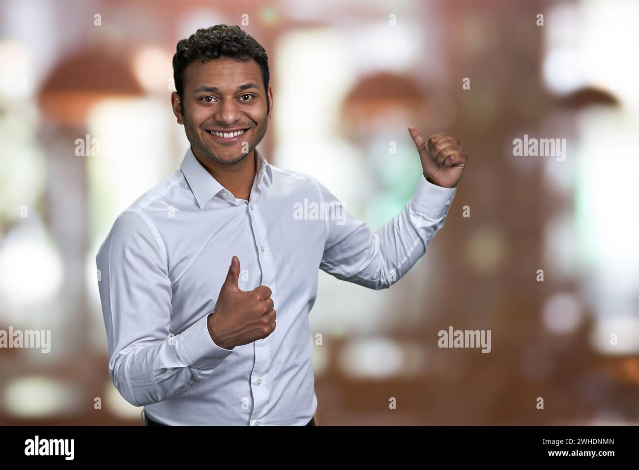 Pointing behind with her thumb hi-res stock photography and images - Alamy