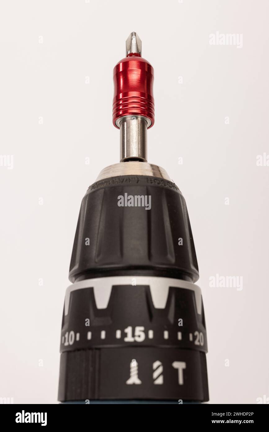 Cordless drill driver with bit holder and inserted Phillips cross ...