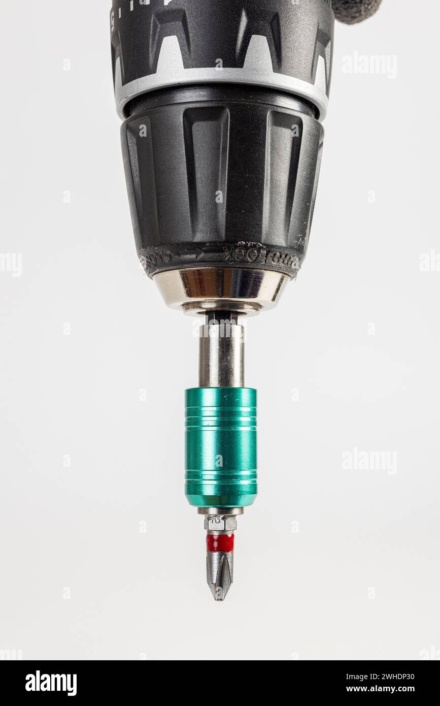 Cordless drill driver with bit holder and inserted Phillips cross ...