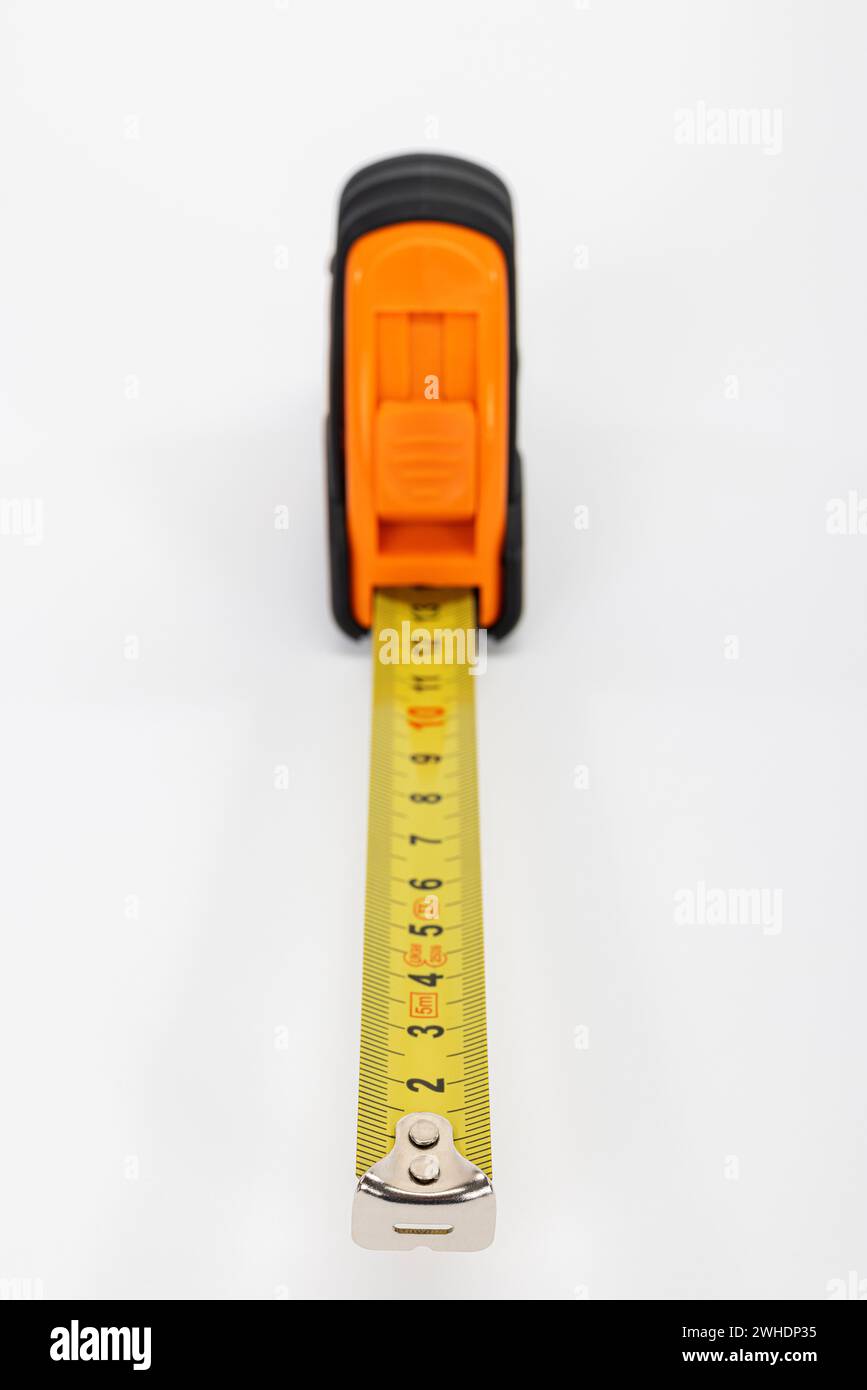 Yellow measuring tape with millimeter and centimeter graduations ...
