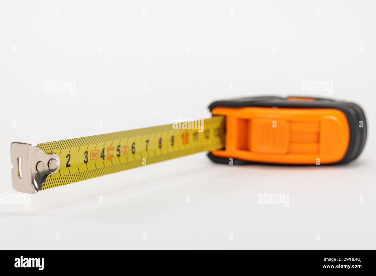 Yellow measuring tape with millimeter and centimeter graduations ...