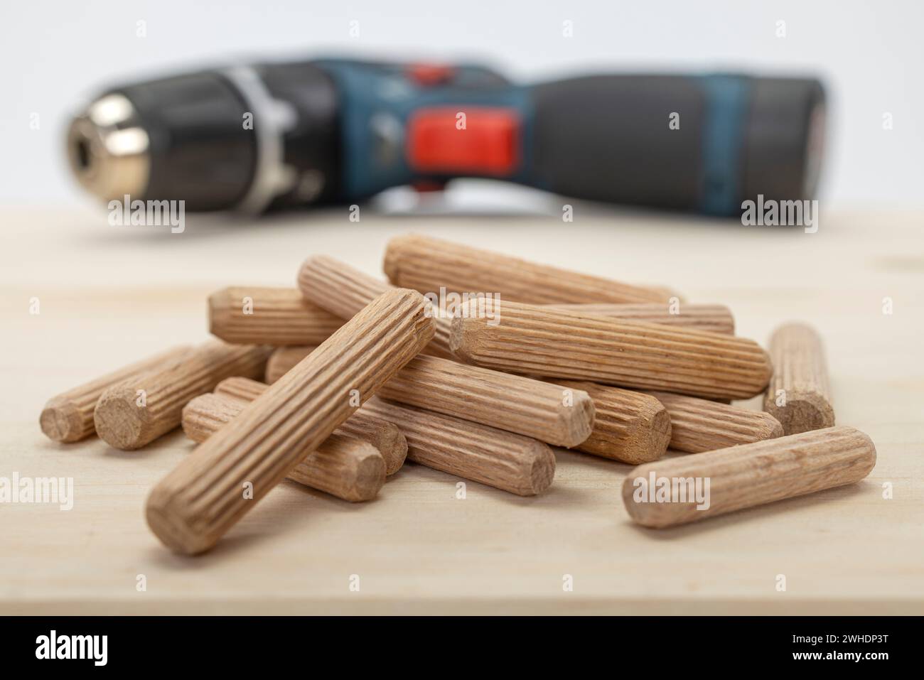 Woodworking, wooden dowels, various sizes, cordless drill, lying on ...