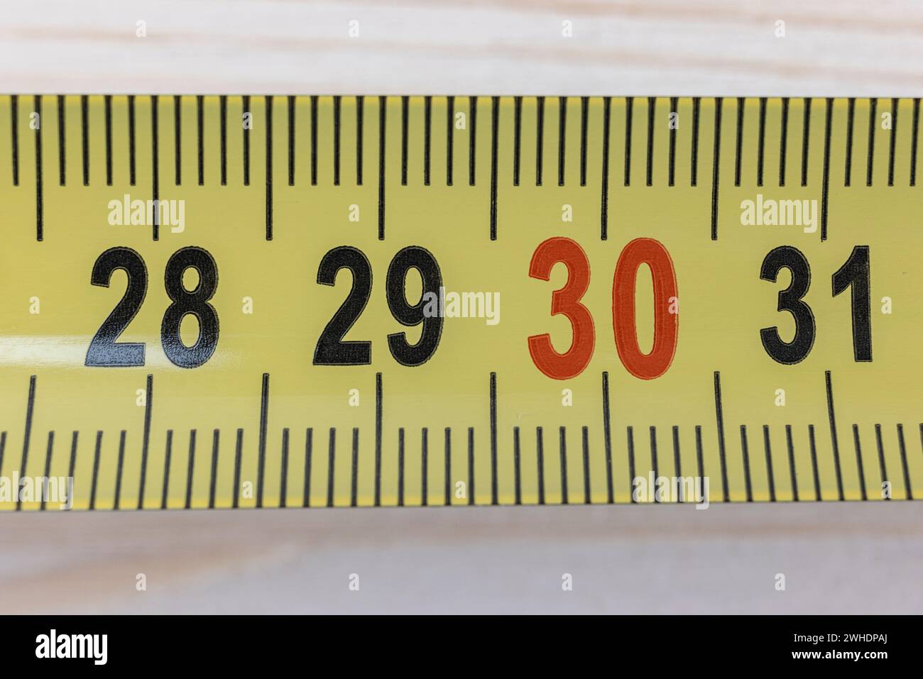 Glulam panel measure to 30 cm, detail, yellow measuring tape with ...