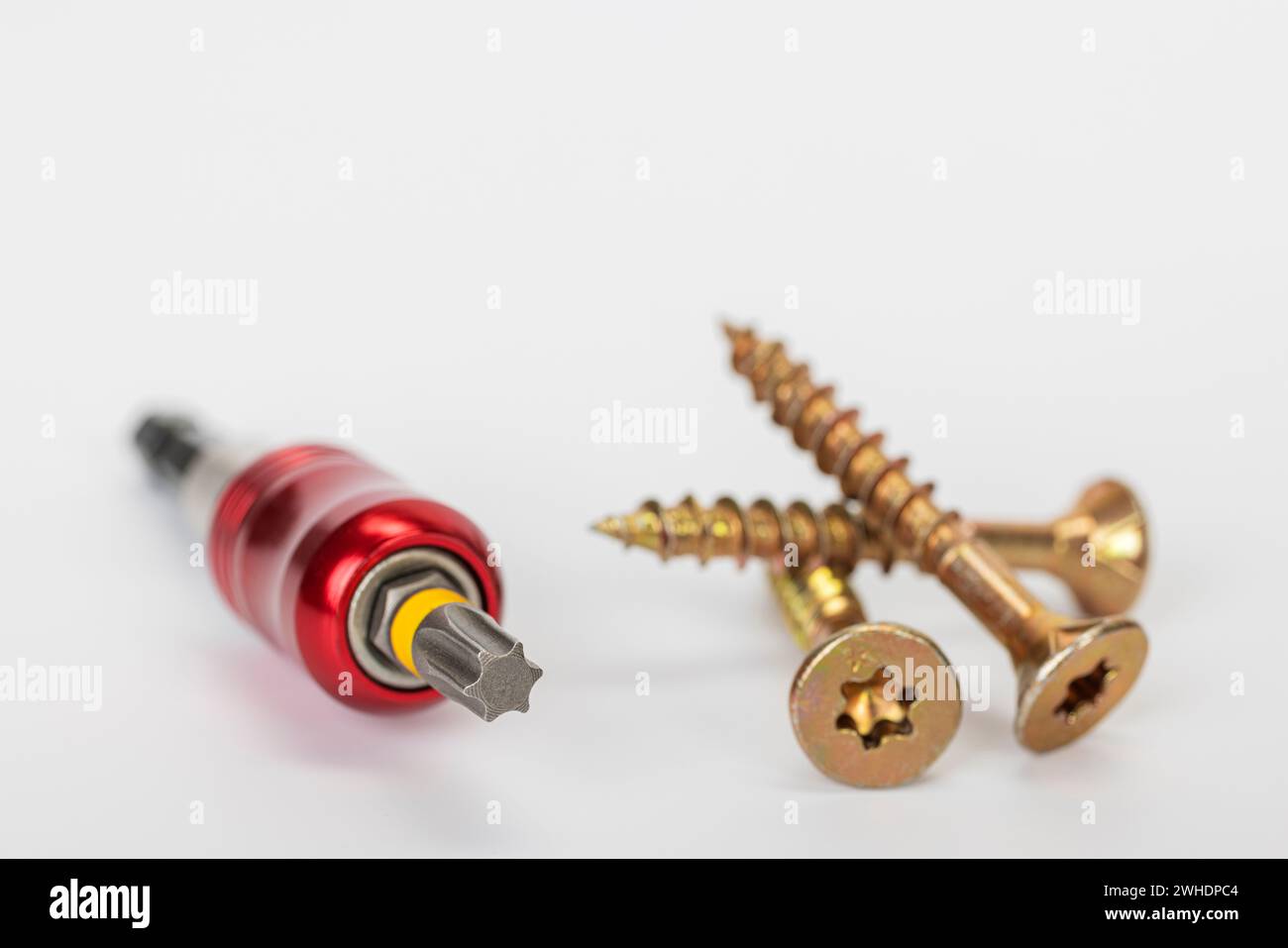 Three Torx chipboard screws with countersunk head, yellow galvanized ...