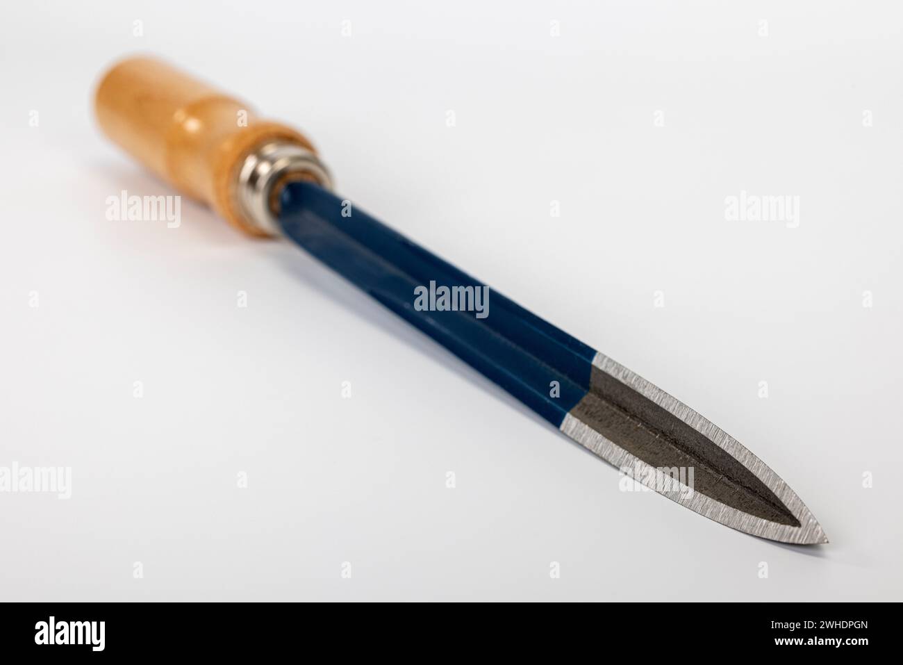 Hollow triangular scraper with wooden handle, blurred, white background ...