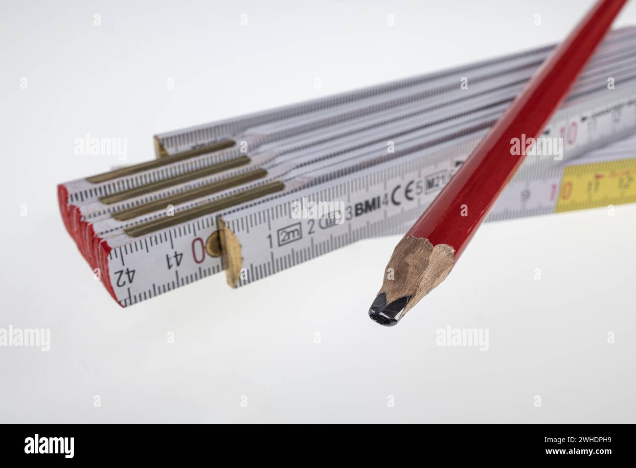 Carpenter's pencil, folding rule, folding ruler, detail, white ...