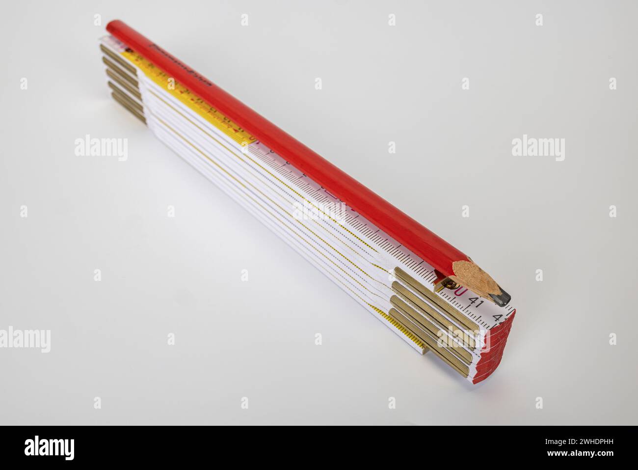 Carpenter's pencil, folding rule, folding ruler, white background Stock ...