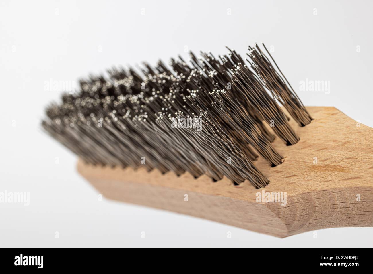 Hand wire brush with wooden handle, stainless steel brush, detail, blur ...