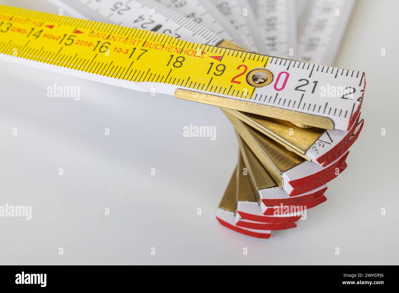 Folding rule, folding ruler, detail, blur, white background Stock Photo ...