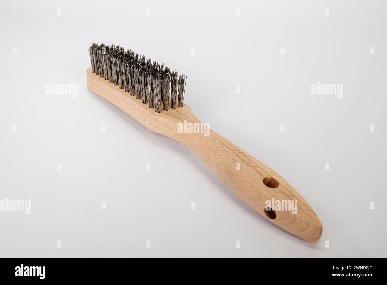 Hand wire brush hi-res stock photography and images - Alamy