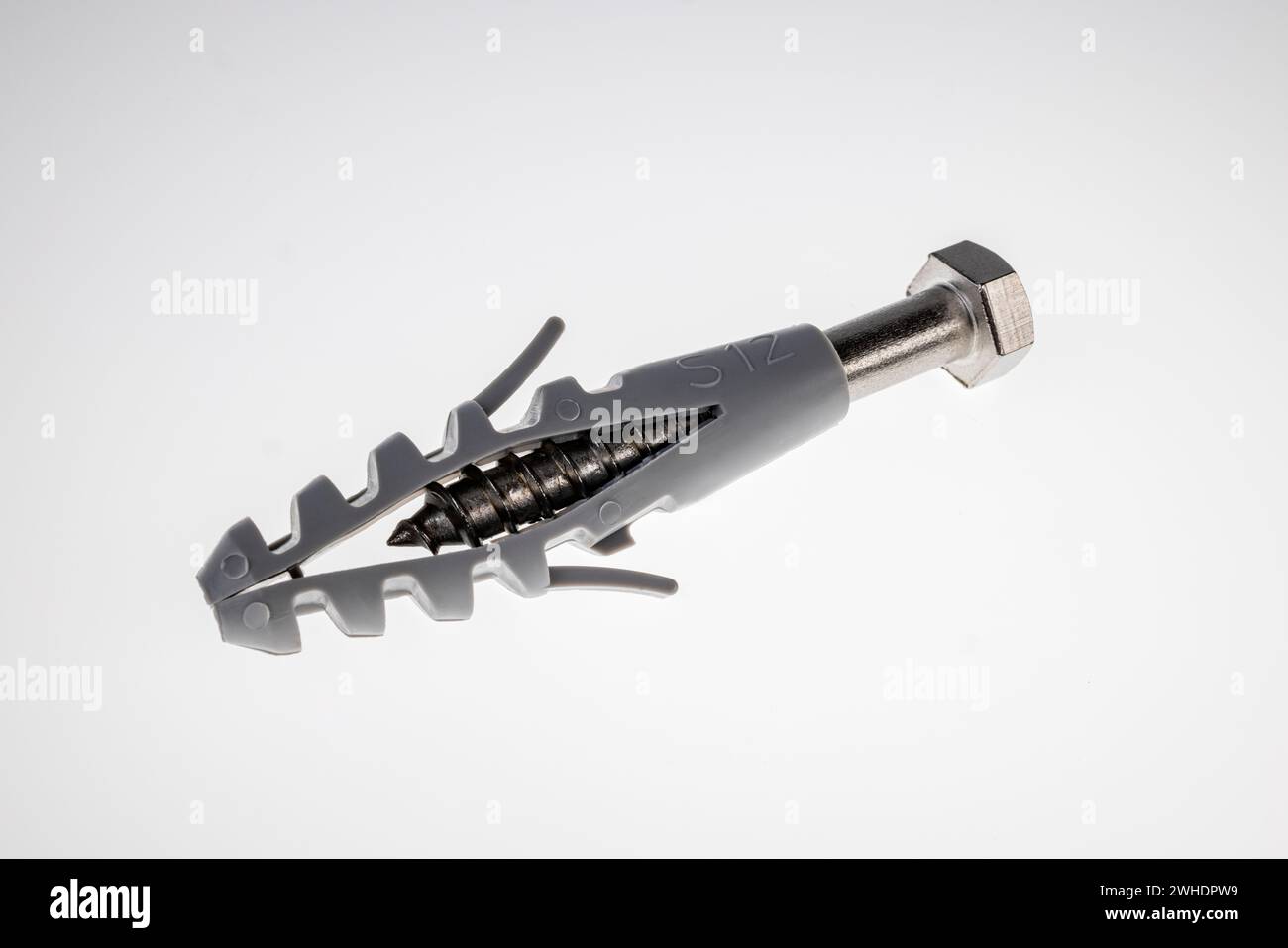 Hexagonal wood screw in dowel, expansion, white background Stock Photo ...