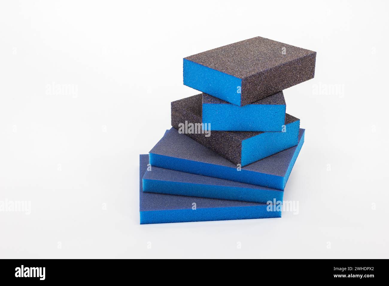 Various sanding sponges, sizes, grits, structures, white background ...